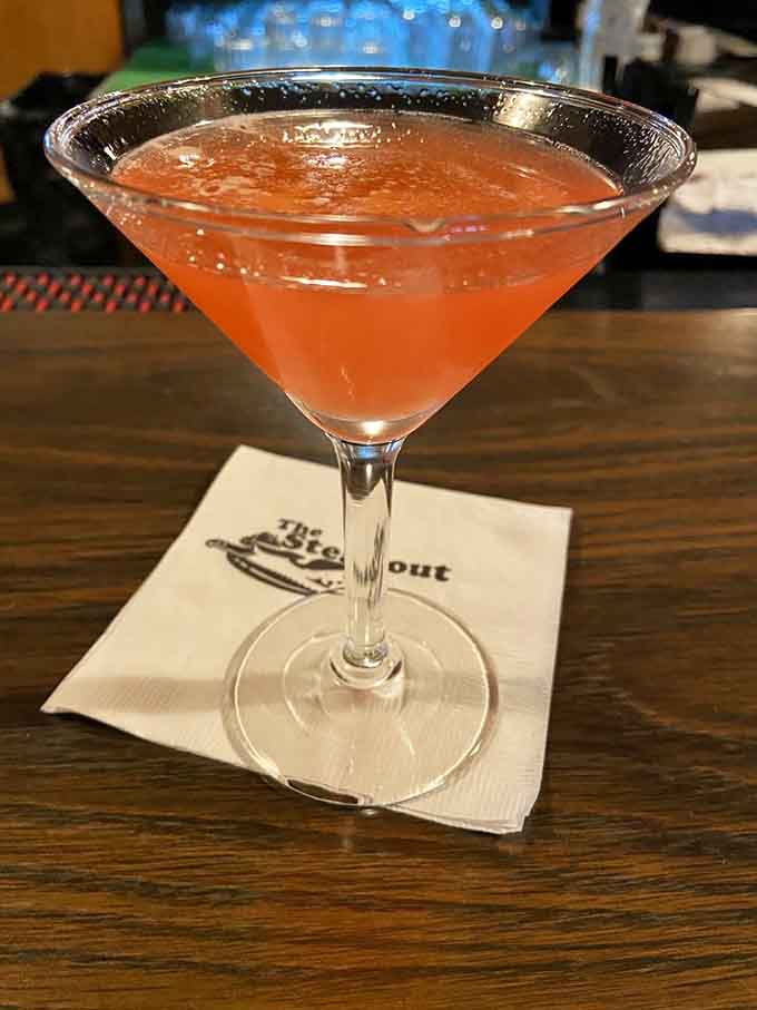 A perfectly pink martini on a branded napkin sets the mood before your steak even arrives.