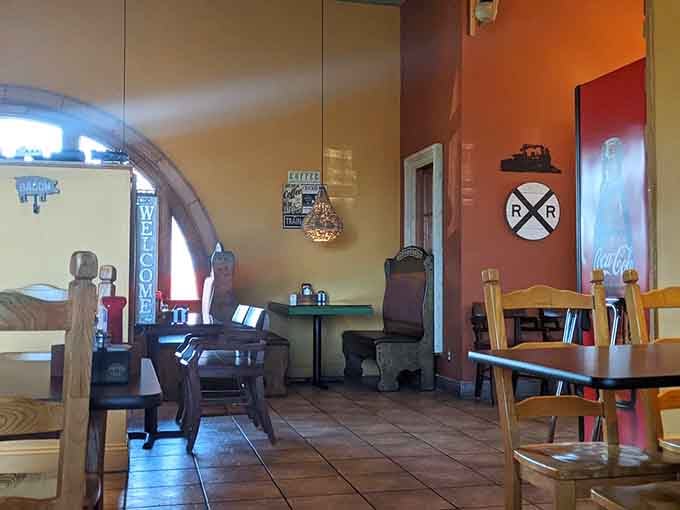Railroad crossing signs and vintage touches remind you that this dining room once welcomed travelers heading to distant destinations.
