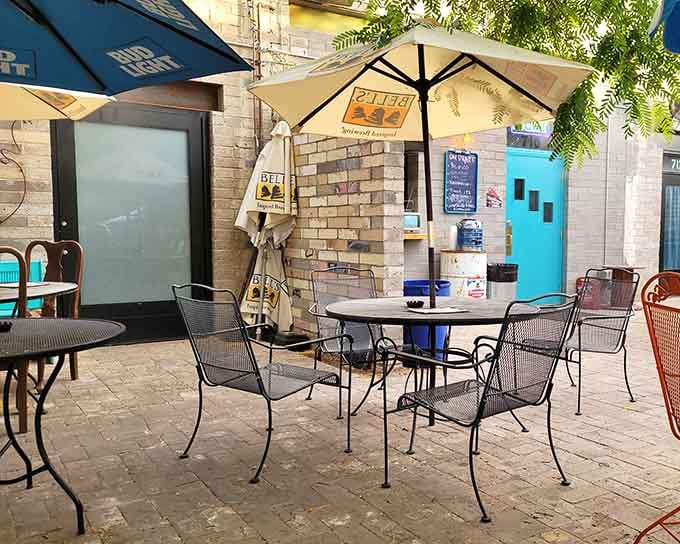 Outdoor seating under umbrellas offers fresh air and sunshine, proving Phoenix patios are undefeated year-round champions.