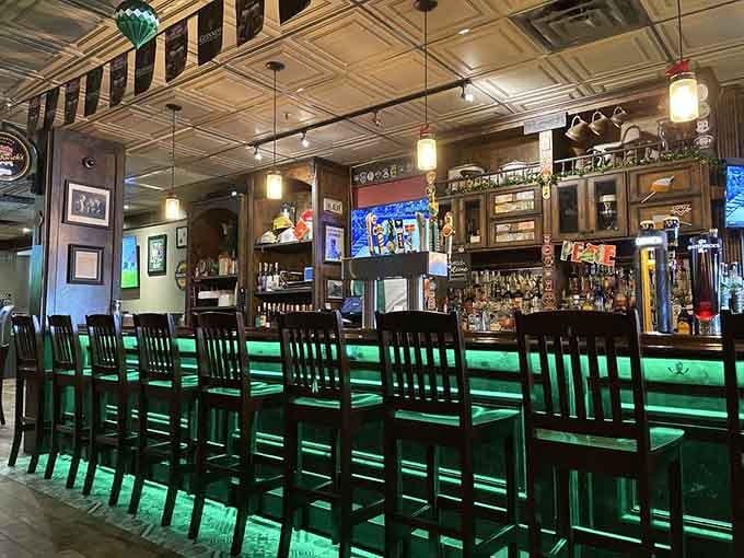 That gorgeous green-lit bar beckons like a beacon, promising good times and even better conversations with fellow patrons.