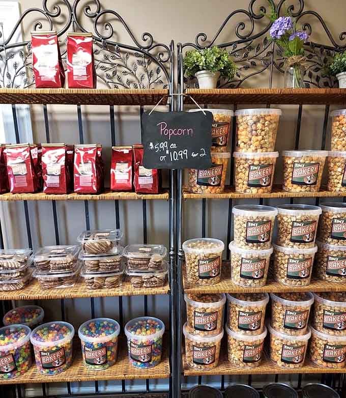 Shelves stocked with popcorn and treats, because apparently this bakery believes in covering all your snacking needs.