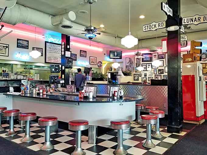 Counter seating with chrome stools where the coffee flows and the conversation never stops, pure diner magic.