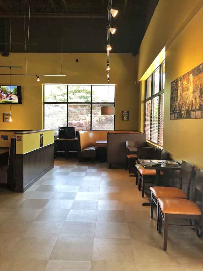 The spacious dining room with high ceilings and booth seating invites you to settle in and stay awhile.