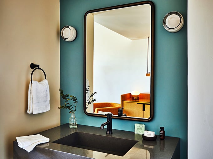 Modern fixtures meet vintage charm in a bathroom that proves small spaces can still make big impressions.