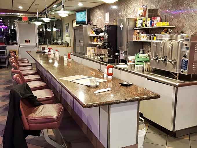 That long counter with pink stools offers the best seats in the house for watching breakfast magic happen.