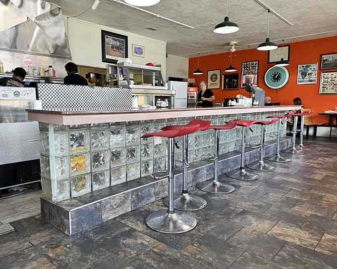 That glass block counter is pure vintage charm, the kind of detail that separates authentic diners from wannabe copycats.