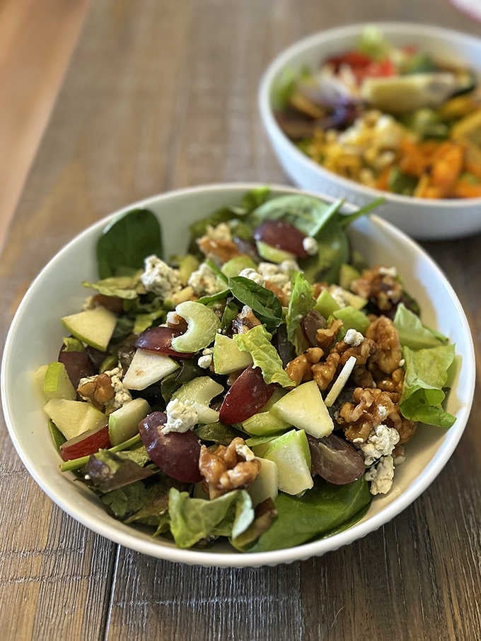 Fresh salads loaded with apples, grapes, walnuts, and blue cheese that bring unexpected sophistication to roadside dining done right.