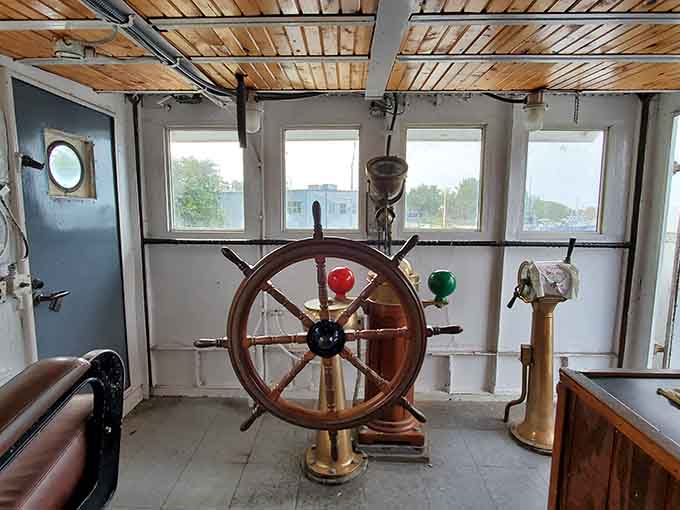 The ship's wheel from the Coast Guard cutter offers a tactile connection to maritime service.