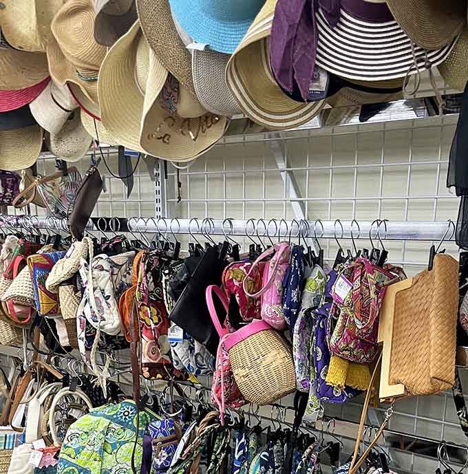Hats and handbags hanging like a fashion museum exhibit, showcasing decades of style waiting for rediscovery and revival.