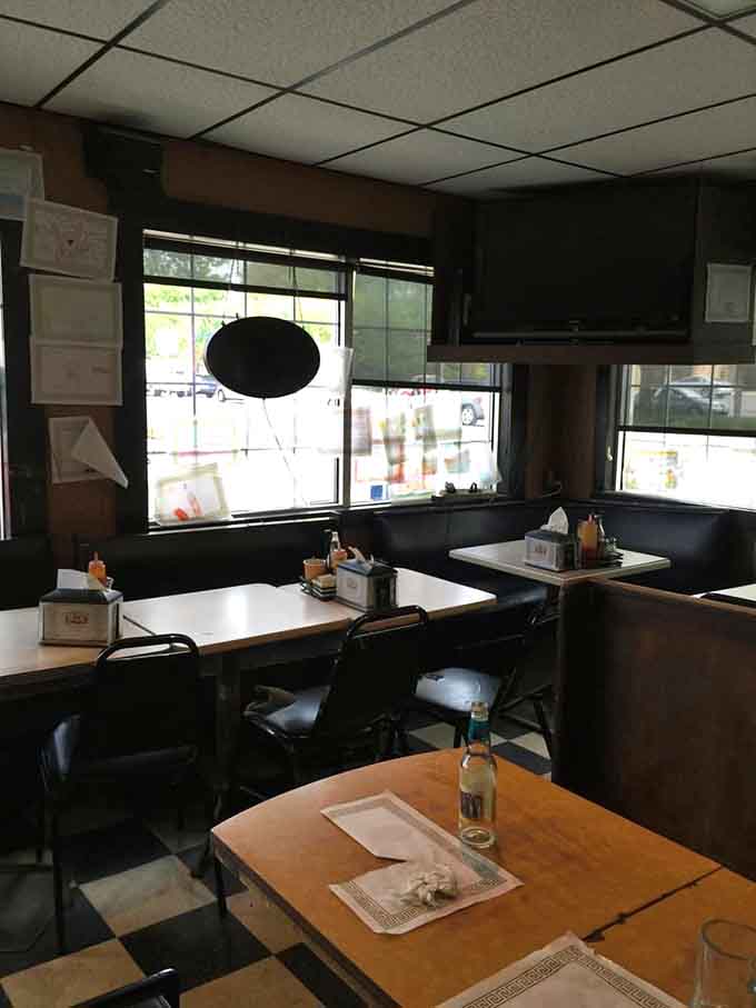 Booths and tables worn smooth by decades of elbows, conversations, and countless meals shared among friends and strangers.