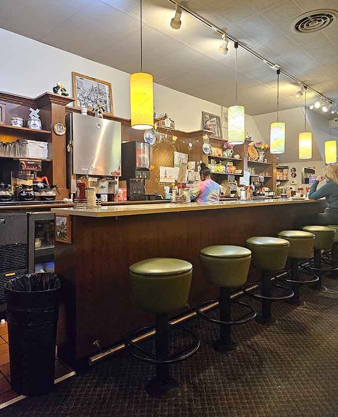 Counter seats offer front-row views of the kitchen magic, where breakfast dreams become delicious reality daily.