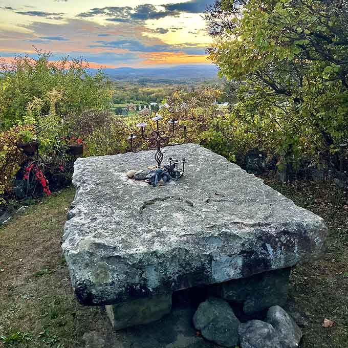 A massive stone table overlooking the valley, perfect for contemplating life's big questions or just eating sandwiches.