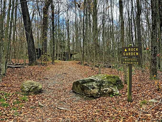 Rock Garden trail marker stands guard over ancient stones that have been here longer than anyone's family tree.