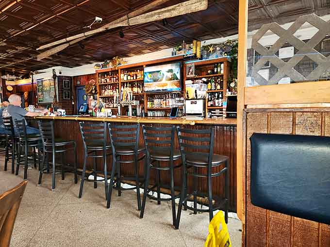 The bar beckons with its impressive bottle collection and that welcoming glow that makes everyone feel like regulars.