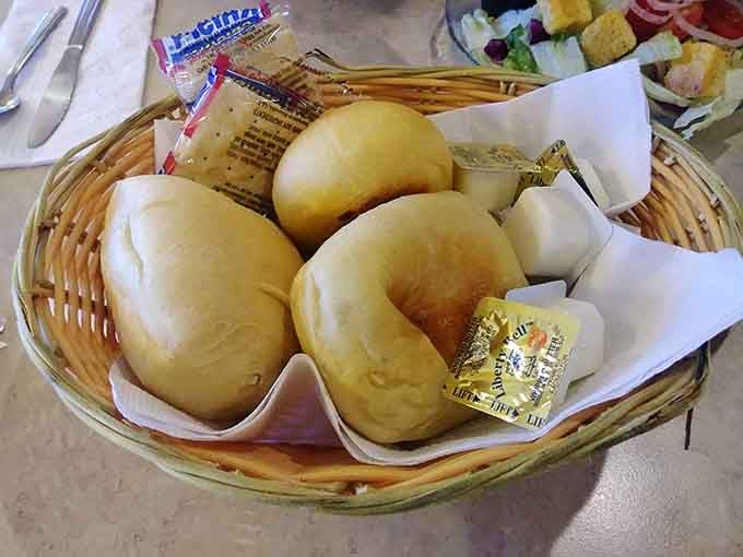 Fresh rolls arriving in a basket like edible happiness you didn't know you were waiting for.