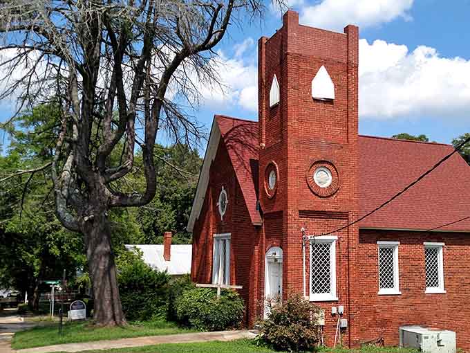 That distinctive red brick church stands as a testament to craftsmanship from an era when details mattered.