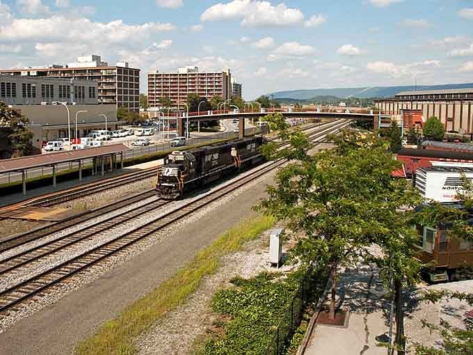 Railroad tracks slice through town carrying freight trains that rumble past like they have since your parents were young.