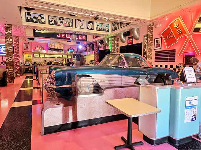 That gleaming Corvette parked inside isn't going anywhere—it's the star attraction at this retro diner paradise.