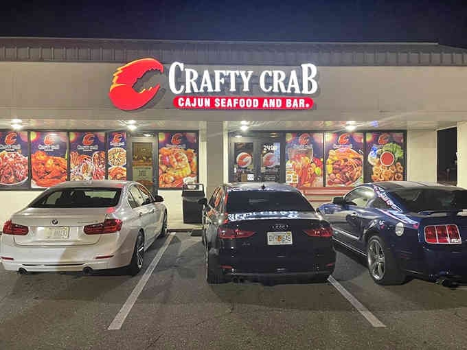 The giant red crab logo glowing at night is like a beacon guiding hungry seafood lovers home.
