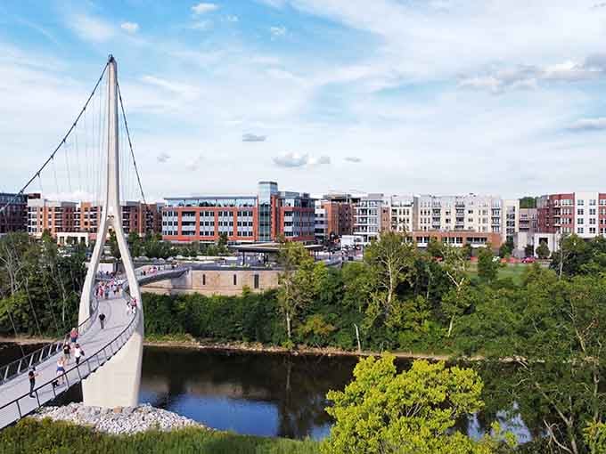 That pedestrian bridge connects communities across the water, turning what could divide into something that brings people together beautifully.