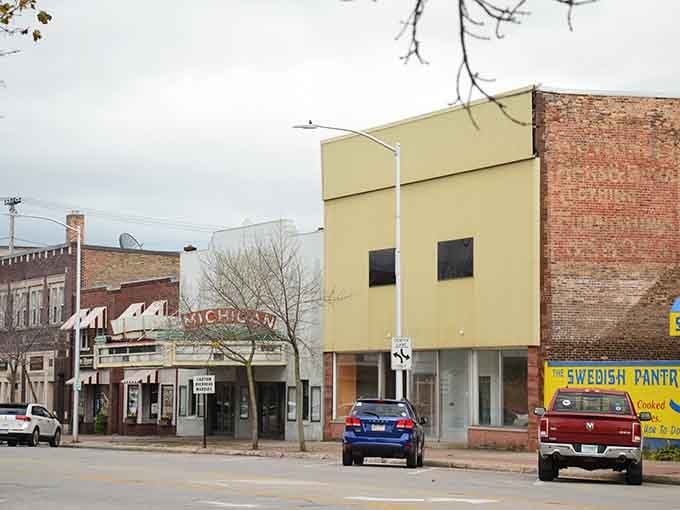 That cheerful yellow building stands out like a beacon, proving small-town architecture doesn't have to be boring.