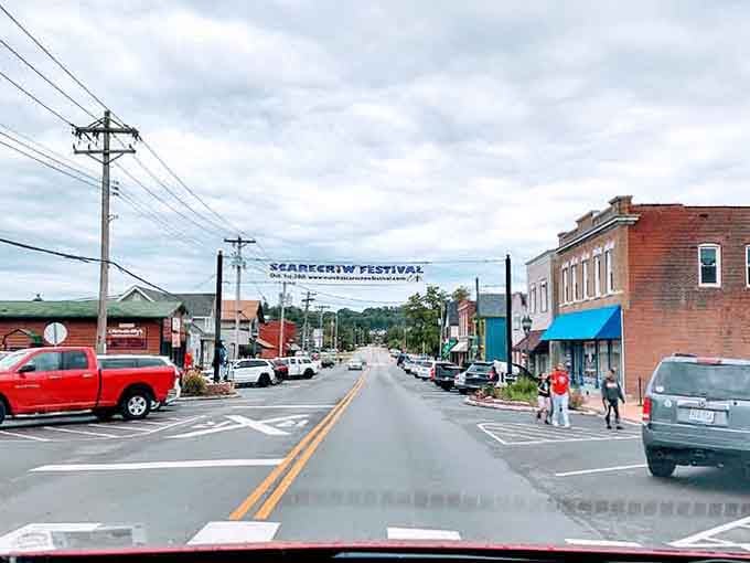 The Scarecrow Festival banner stretches across main street, promising the kind of wholesome fun your younger self would have loved.