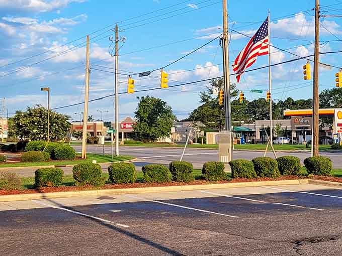 That proud American flag waves over Goldsboro's main intersection where patriotism and practical living costs go hand in hand.