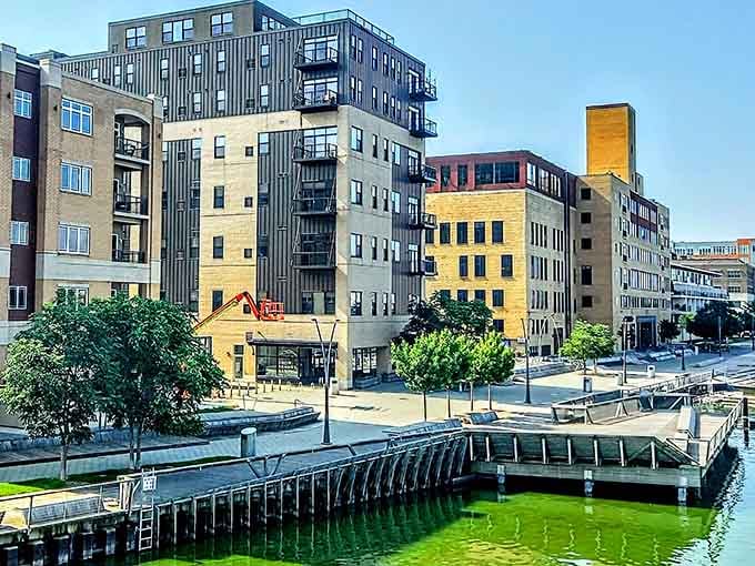 Contemporary harbor district where the architecture's sharp, the docks are inviting, and the water's... well, enthusiastically green.