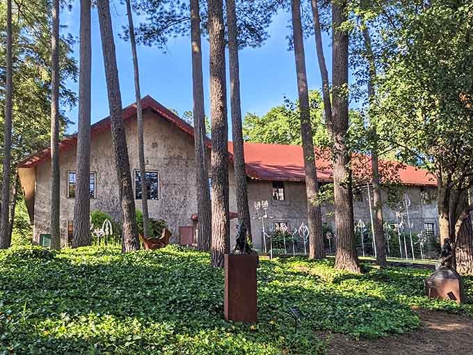 Historic buildings surrounded by tall pines create an artisan compound where creativity has flourished for generations past.