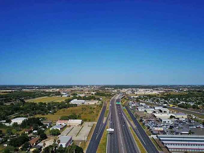 Highway views reveal the town's practical layout, where everything you need sits conveniently within easy reach.