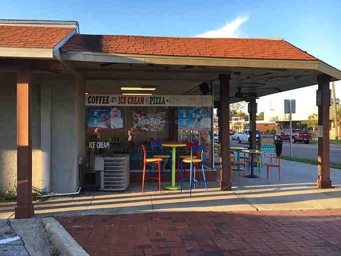 The ice cream shop beckons with colorful chairs and sweet promises of afternoon treats without breaking the bank.