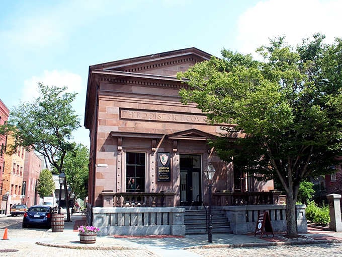 This classical courthouse facade radiates small-town dignity, the kind of architecture that makes you want to dress up just walking past.