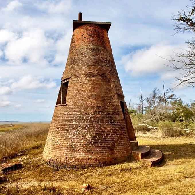 Like an ancient Roman tower that wandered to the Carolina coast, this crumbling brick sentinel whispers tales of forgotten times.