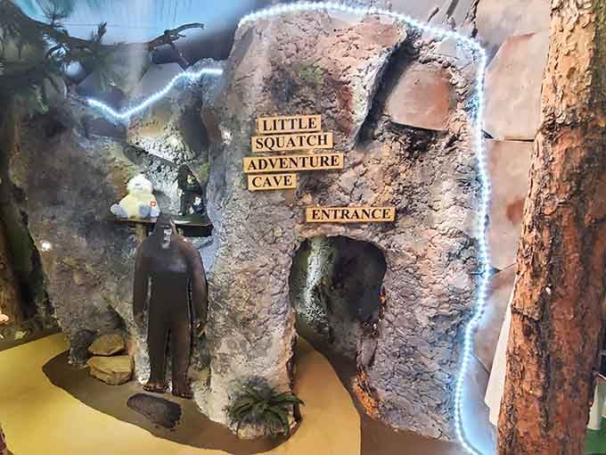 A miniature cave entrance beckons the curious, complete with its own Sasquatch guardian standing watch over tiny adventures.