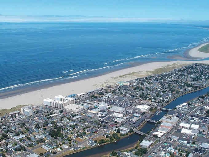 From above, Seaside spreads between river and ocean, perfectly positioned where fresh water meets endless Pacific blue.
