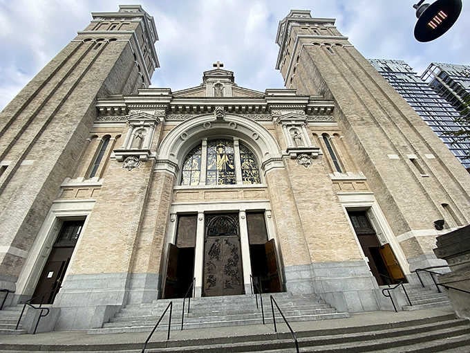 Twin towers flank the ornate entrance where carved details and classical proportions command respect and quiet awe.