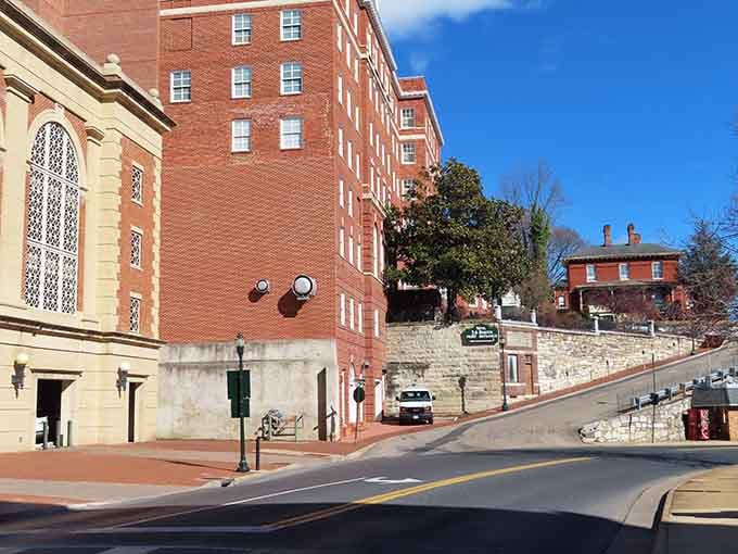 Brick buildings climb the hillside in layers, creating a cityscape that looks like it was designed by an artist.