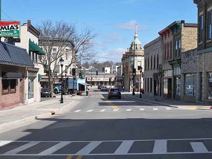 Waukesha's main street stretches invitingly ahead, where church steeples and storefronts create classic small-city American charm.