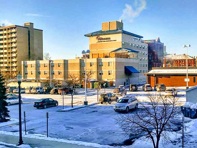 Fresh snow blankets the downtown, transforming everyday buildings into a winter wonderland postcard you'd actually want to receive.