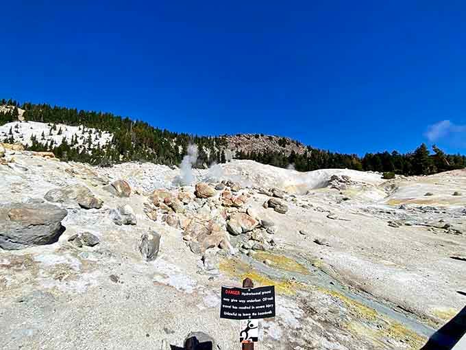 Under brilliant blue skies, this volcanic landscape steams and bubbles, reminding visitors that Earth's fiery heart still beats strong.