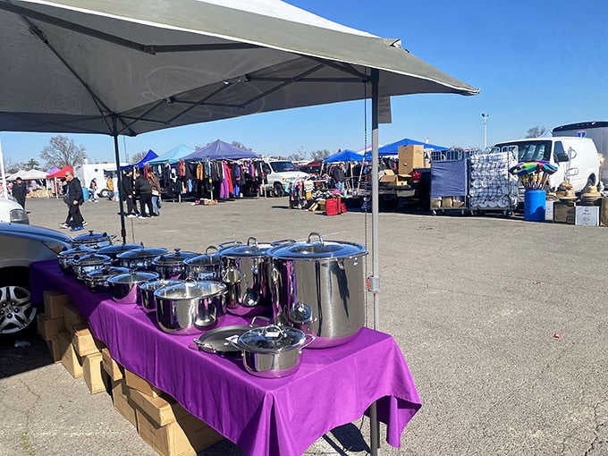 Gleaming cookware catches the light on purple tablecloths&mdash;someone's upgrading their kitchen and you're reaping the benefits.