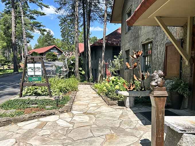 The stone pathway leads through gardens where craftspeople keep traditional skills alive in a modern world rushing by.