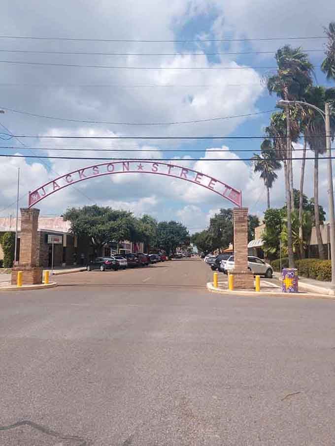 That welcoming arch over Jackson Street announces you've arrived somewhere special, where community still matters most.