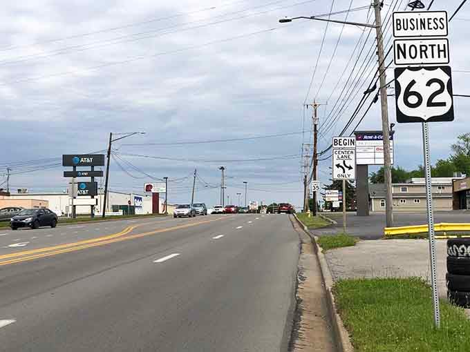 Route 62 cuts through town where strip malls and green spaces coexist in that uniquely American roadside ballet.