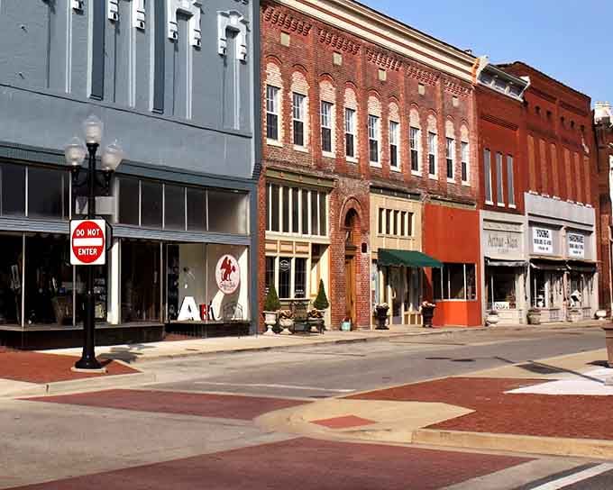 Red brick facades catch the afternoon sun, highlighting details that modern construction simply can't replicate anymore.