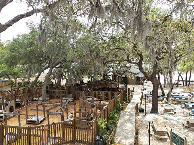 Spanish moss drapes from ancient oaks like nature's curtains, creating the most romantic outdoor dining room imaginable.