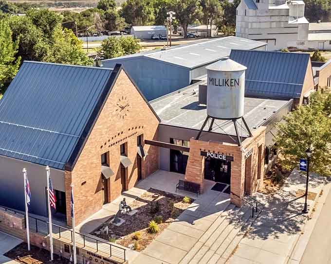 That water tower proclaims the town's name like a proud badge above the community center's modern architecture.