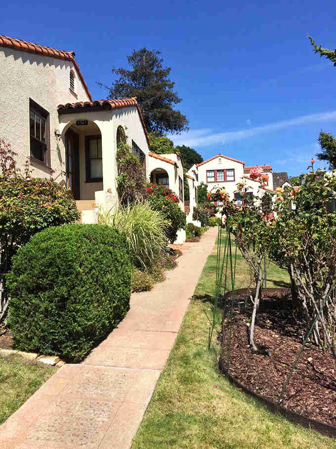 Arched doorways and climbing vines create a European village scene that's been hiding in the Berkeley hills.