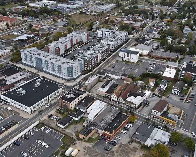 Modern development meets established neighborhoods in this bird's-eye view of a community finding its balance.