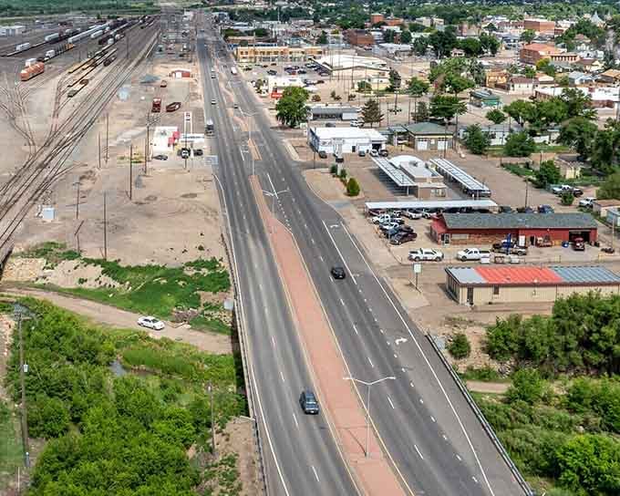 Main street from above&mdash;where the asphalt's fresh, the pace is honest, and those railroad lines have been writing America's story for generations.